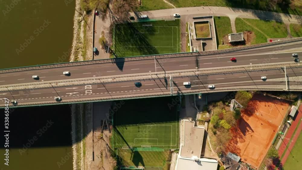 Ascending aerial drone top view of a highway bridge with a lot of ...