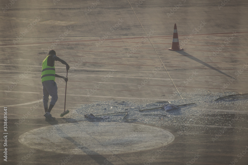 Disaser! A broken glass window on the apron of the modern airport ...