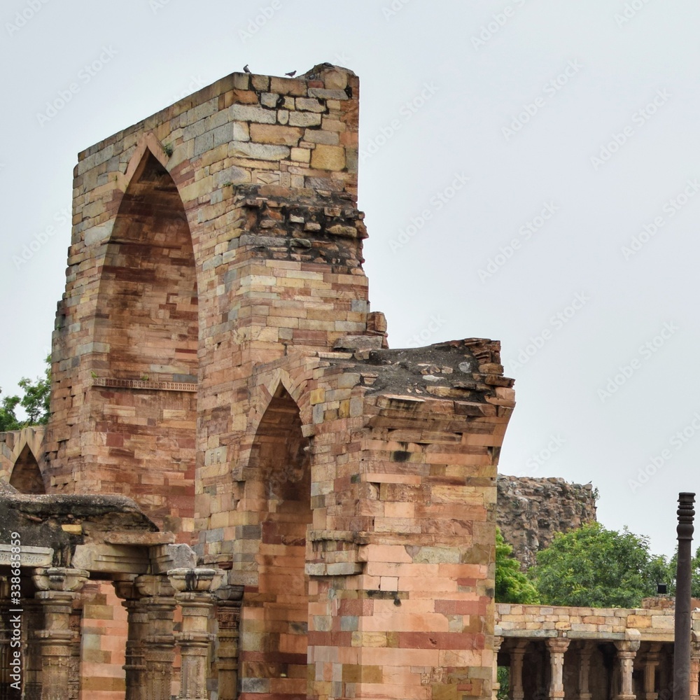 Inside the Qutub Minar Complex with antic ruins and inner square ...