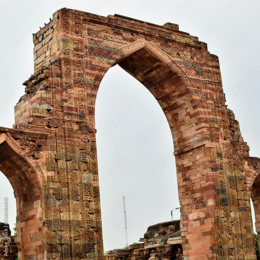 Inside the Qutub Minar Complex with antic ruins and inner square ...