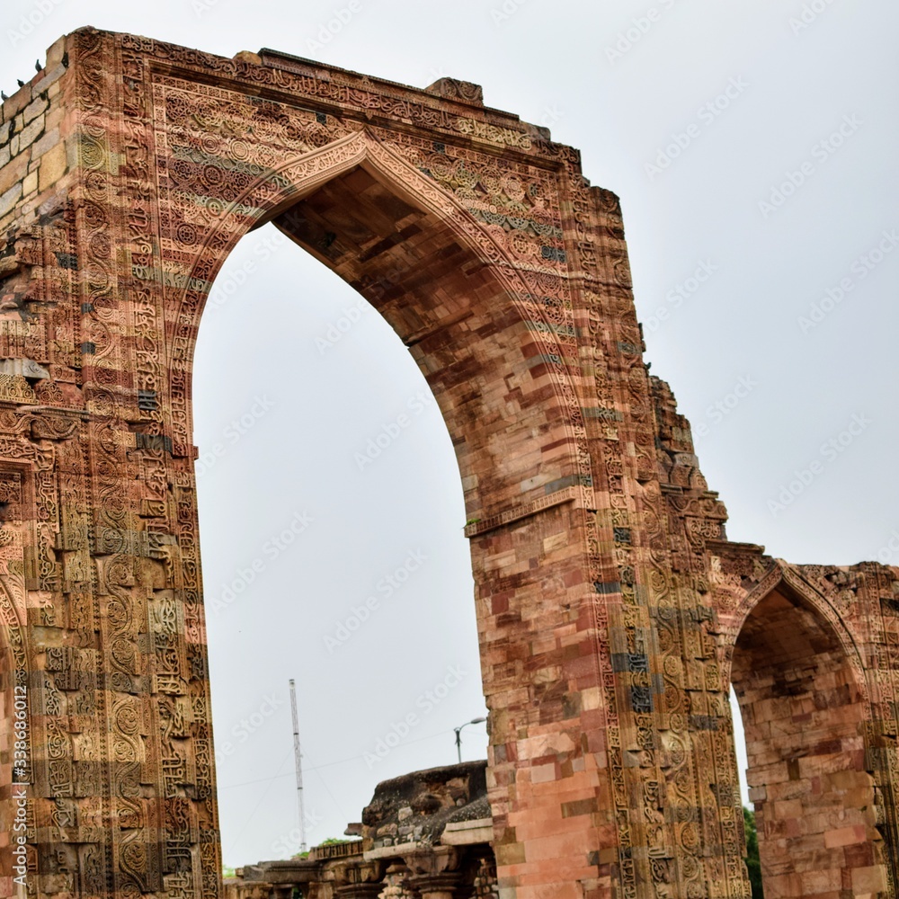 Inside the Qutub Minar Complex with antic ruins and inner square ...