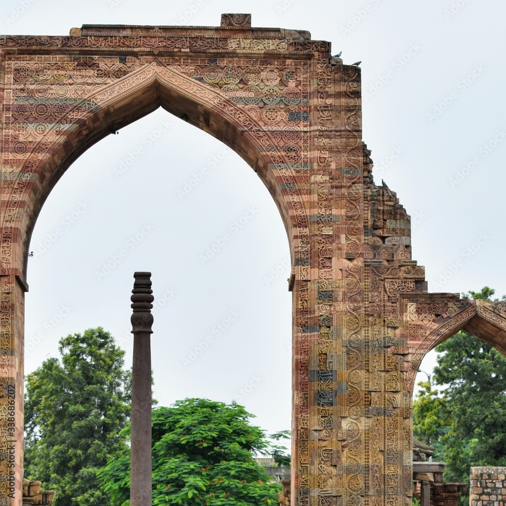 Inside the Qutub Minar Complex with antic ruins and inner square ...
