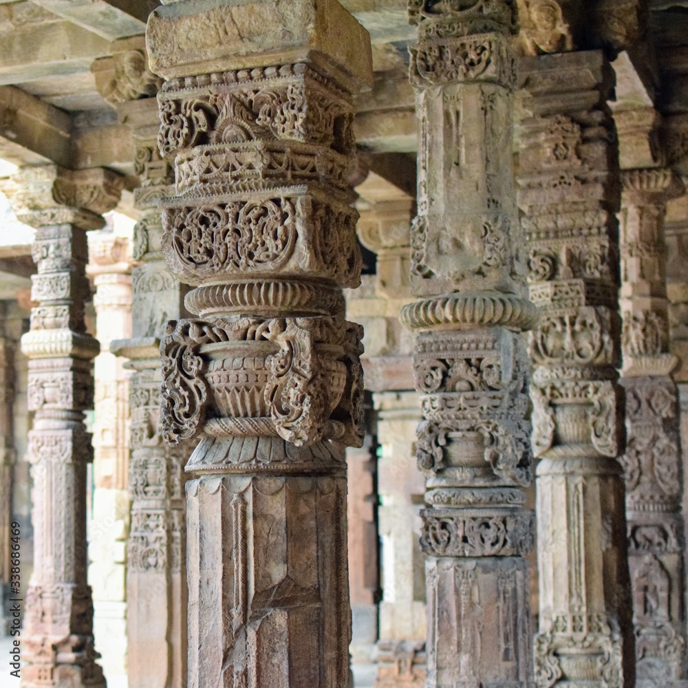 Inside the Qutub Minar Complex with antic ruins and inner square ...