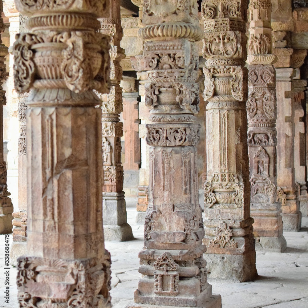Inside the Qutub Minar Complex with antic ruins and inner square ...
