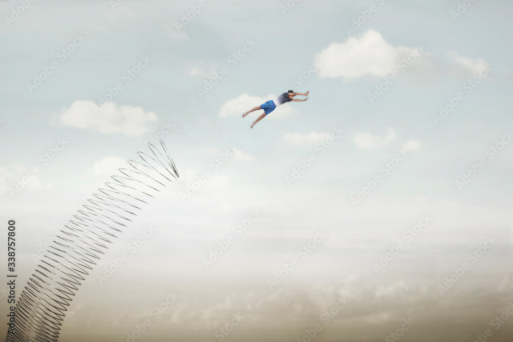 surreal boy launched from a spring in the sky Stock Photo | Adobe Stock