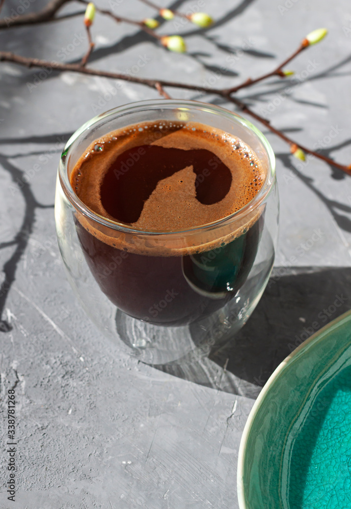 Morning break or breakfast concept close up with a cup of black coffee ...