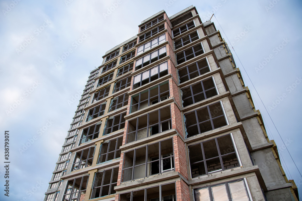 Installation of double-glazed windows in a multi-storey building at a ...