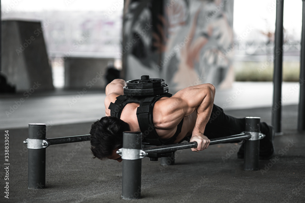 Man during workout in the gym Concept: power, strength, healthy ...