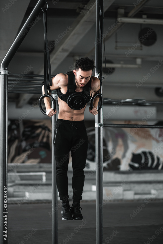 Man during workout in the gym Concept: power, strength, healthy ...