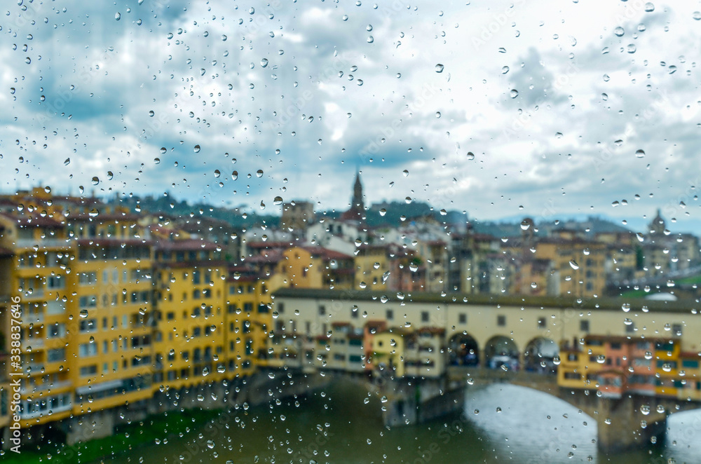 Florence old town with Ponte Vecchio on a rainy day seen through a ...