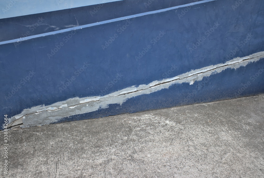 Broken, sloping, oblique Of different levels of flooring Blue walls ...