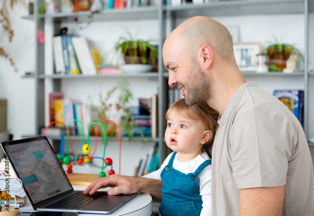 Young attractive father freelance worker working home with baby Stock ...