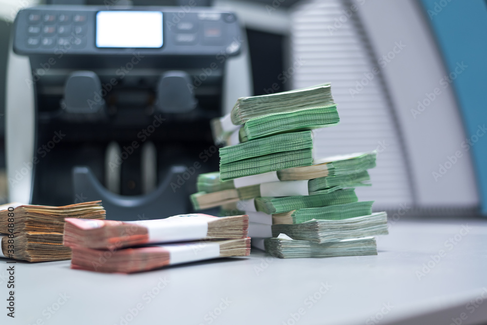 Bundles of banknotes divided into groups with currency straps placed on ...