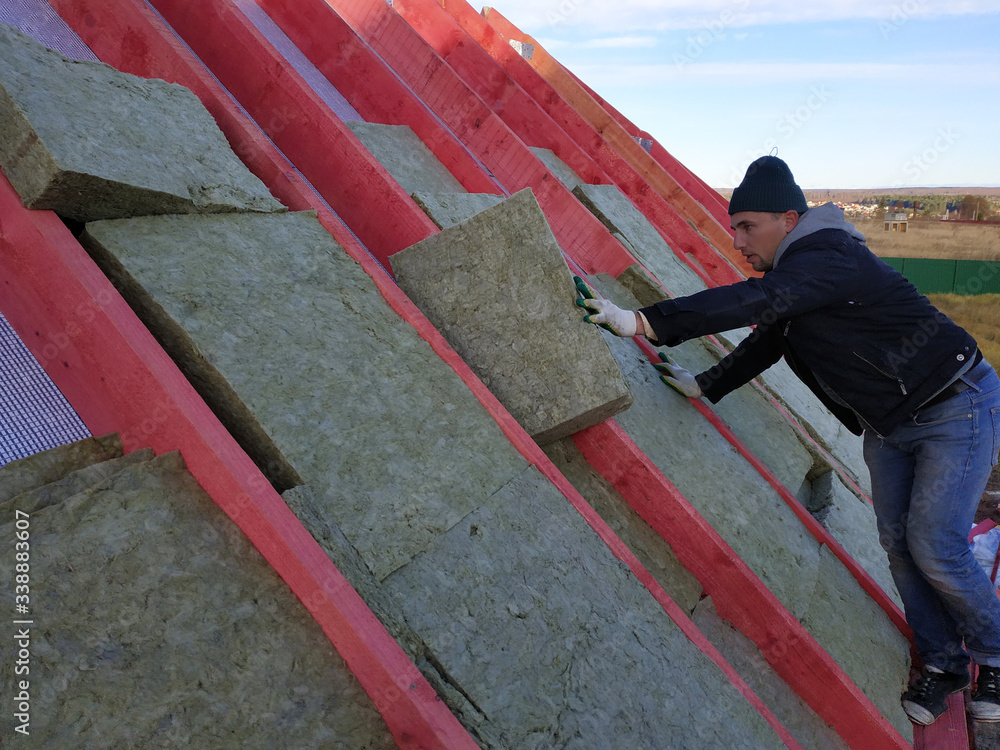 Roof insulation using mineral wool, insulation outside the roof. Stock ...
