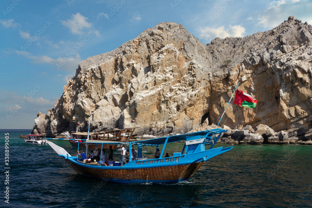 Sailing tourist dhow boat in Oman mountain fjords, Khasab. Stock Photo ...