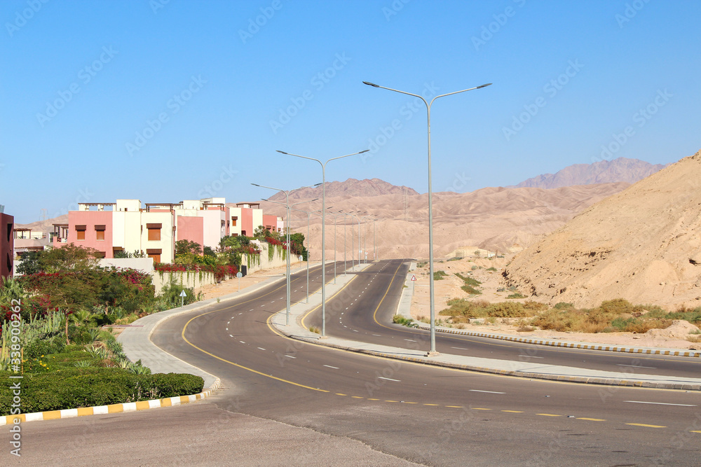 View of empty South Beach Highway near Tala Bay tourist resort district ...