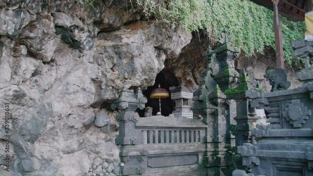 Nice pan of the bat cave temple in Bali, Indonesia. Goa Lawah is famous ...