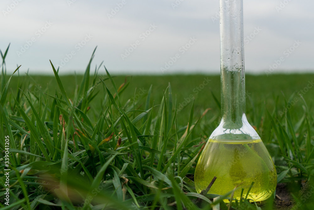 Image of a glass flask with a chemical solution on the background of ...