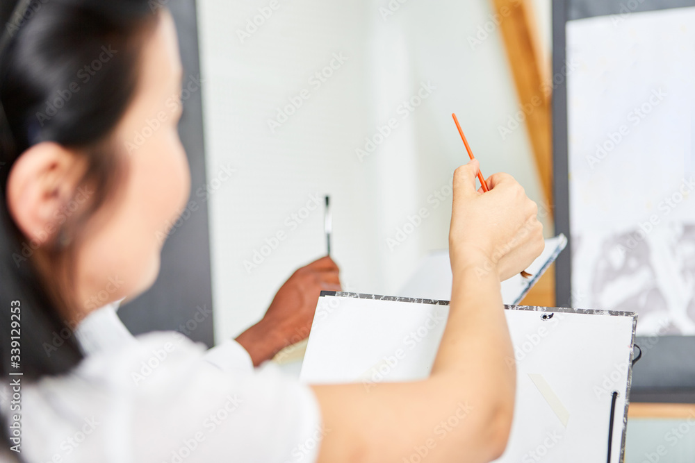 Woman as a beginner or art student learns to paint Stock Photo | Adobe ...