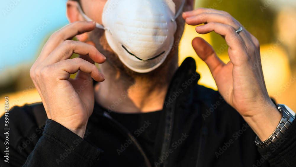 Coronavirus face mask background. Closeup of hands and covered face of ...