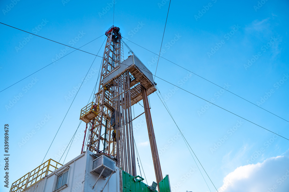 Oil and Gas Drilling Rig onshore dessert with dramatic cloudscape. Oil ...