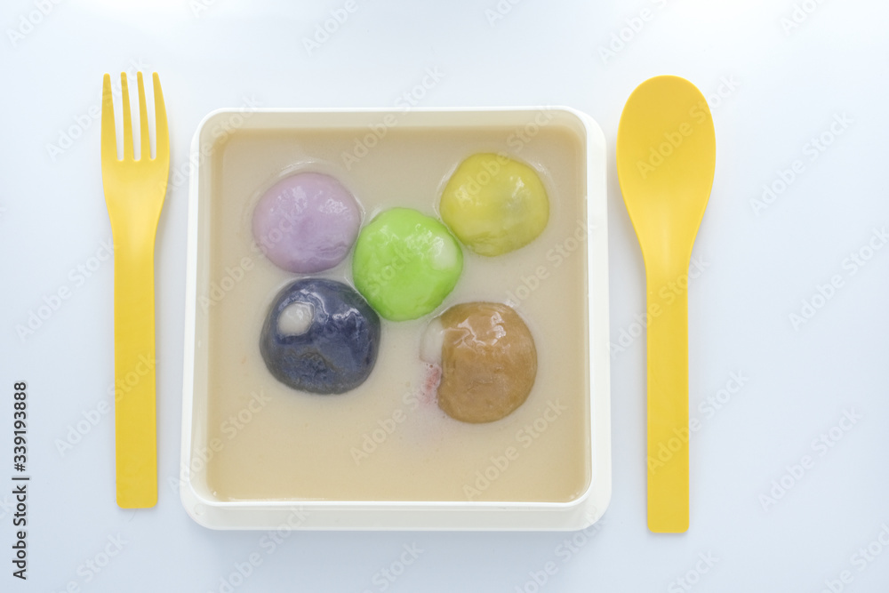 Close-up big colorful rice balls in sweet coconut milk cream, Thai ...