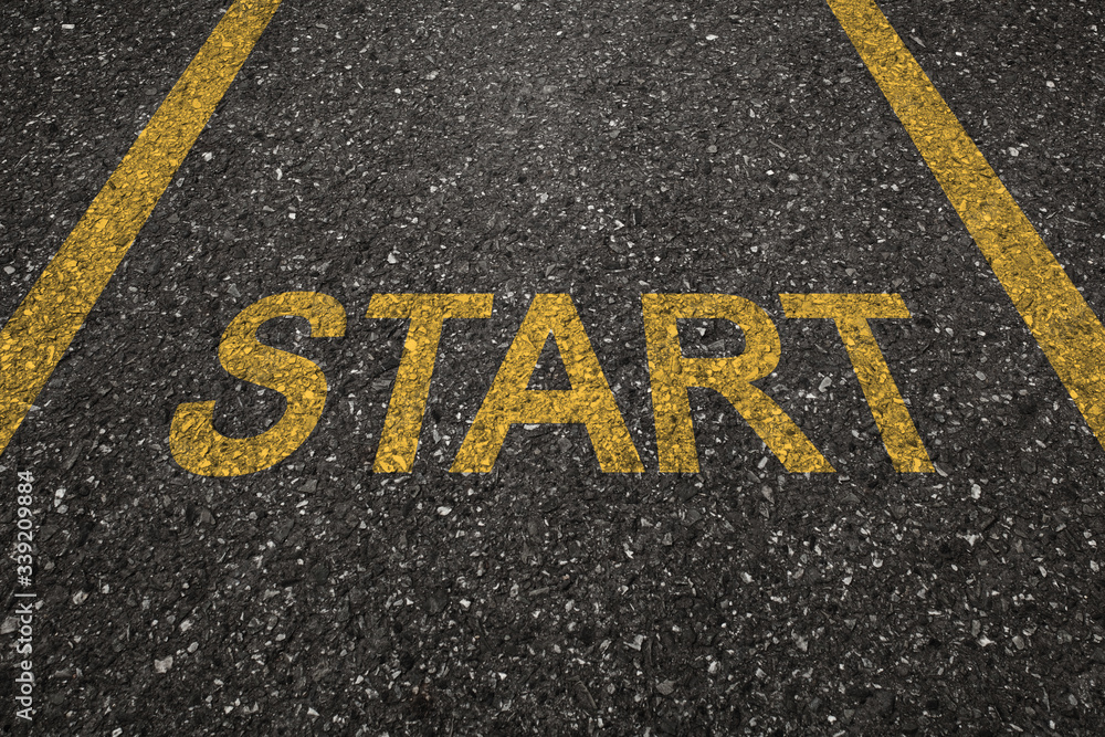 Asphalt road with start letters painted on the surface. An image of a ...