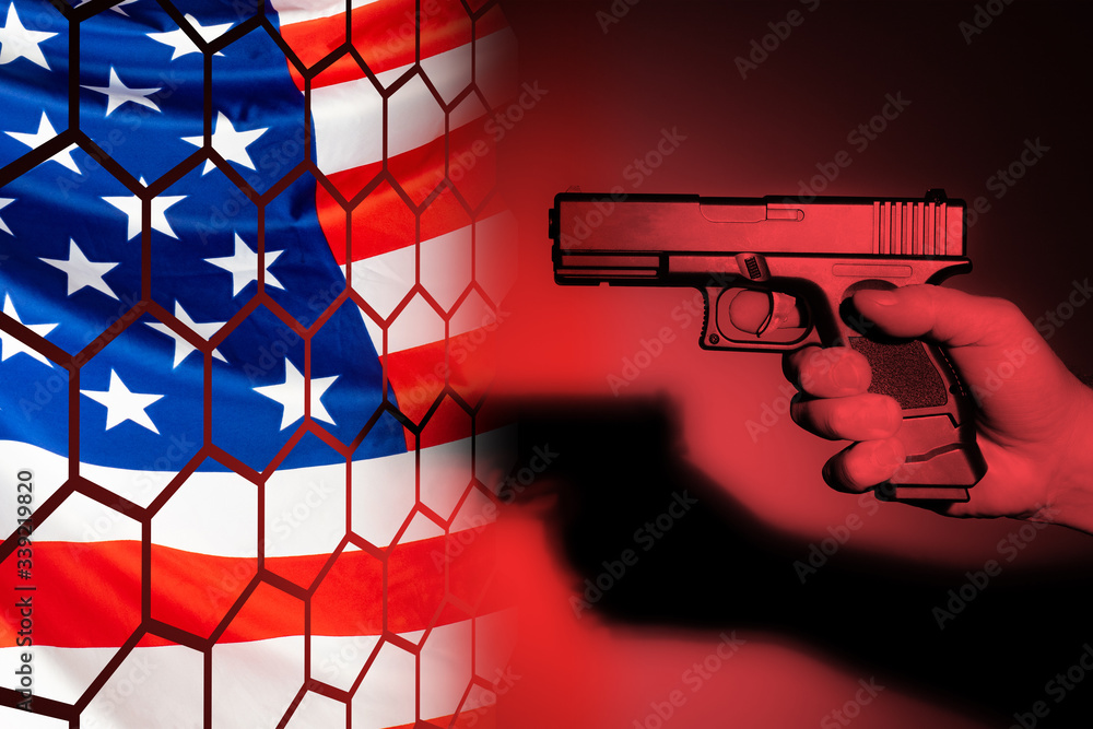 Shot USA. Man with a gun next to the flag of America. Lattice on the ...