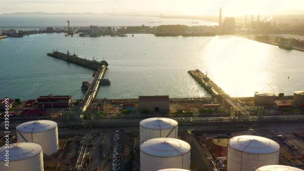 Aerial view oil treminal with storage tank farm, offshore oilrig ...