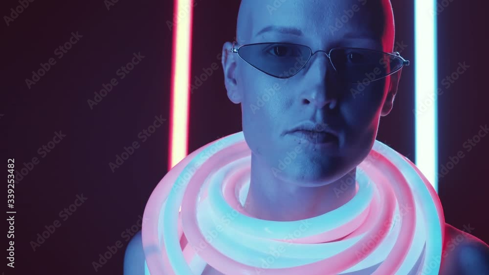 Chest up studio shot of young bald woman in trendy eyeglasses and ...