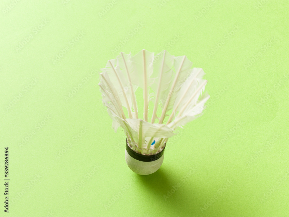 White Feather Shuttlecock with a green colour background stock isolated ...