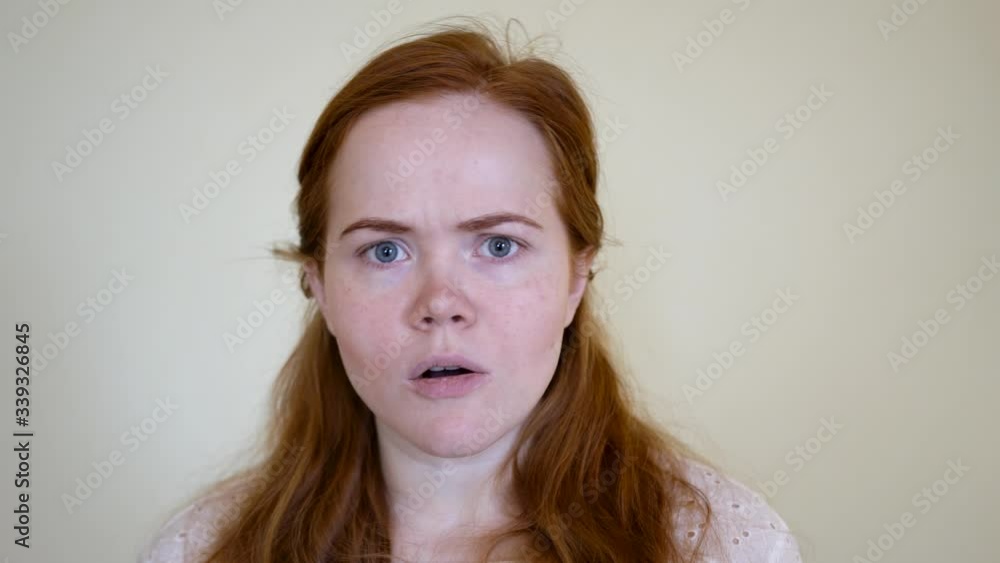 surprised. Startled and impressed, charmed by pretty red-haired millennial girl, cast aside Jew ...