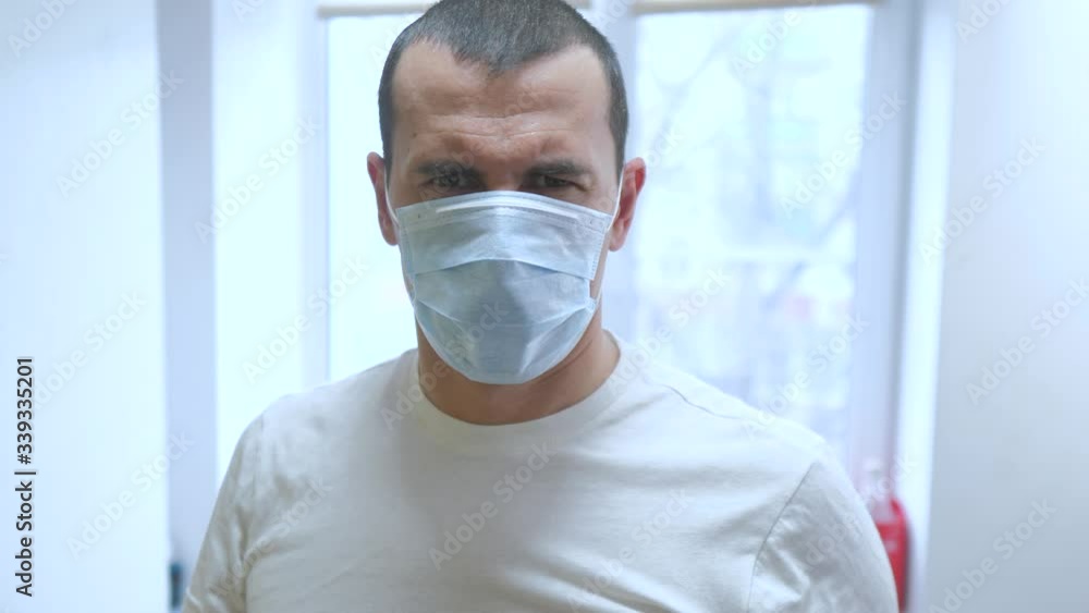 man in a medical mask shows a gesture stop infection disease. concept ...