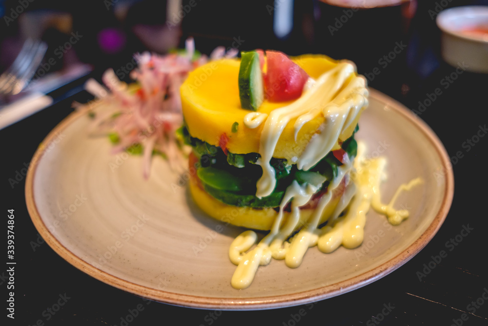 Beautiful and delicious vegetarian "Causa Limeña" with mayo, avocado ...