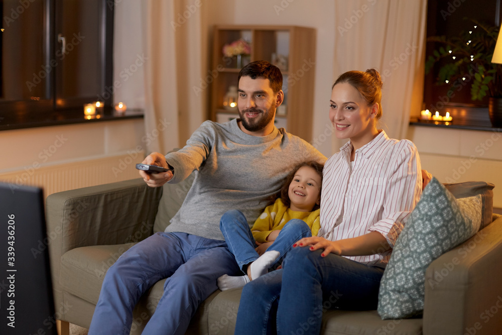 family, leisure and people concept - happy smiling father with remote ...