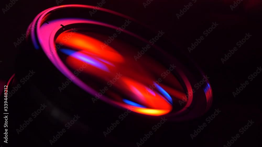 Stylized cinematic red and blue lighting swipe of camera lens glass ...