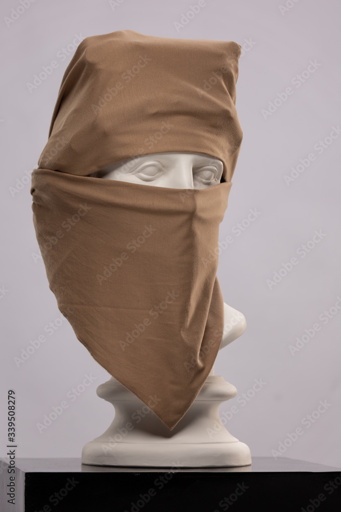 White plaster statue of a bust of Apollo Belvedere in hijab niqab Stock ...