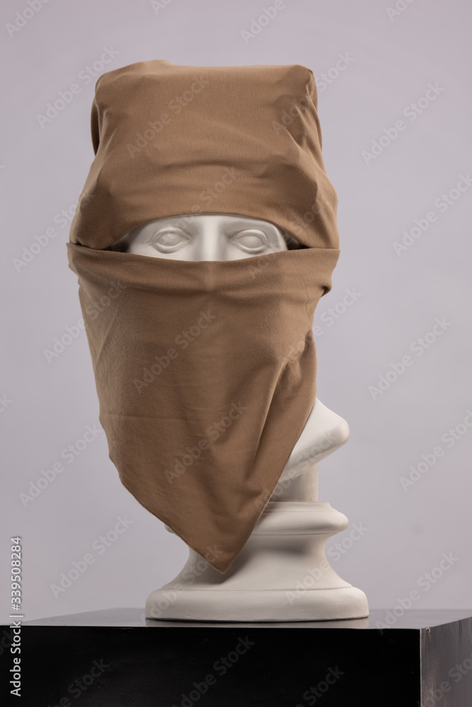 White plaster statue of a bust of Apollo Belvedere in hijab niqab Stock ...
