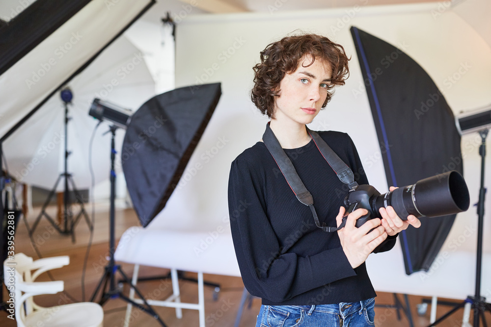 Young woman as a freelance photographer with camera Stock Photo | Adobe ...
