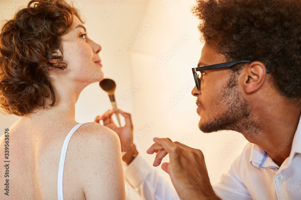Make-up artist make-up model for photo shoot Stock Photo | Adobe Stock