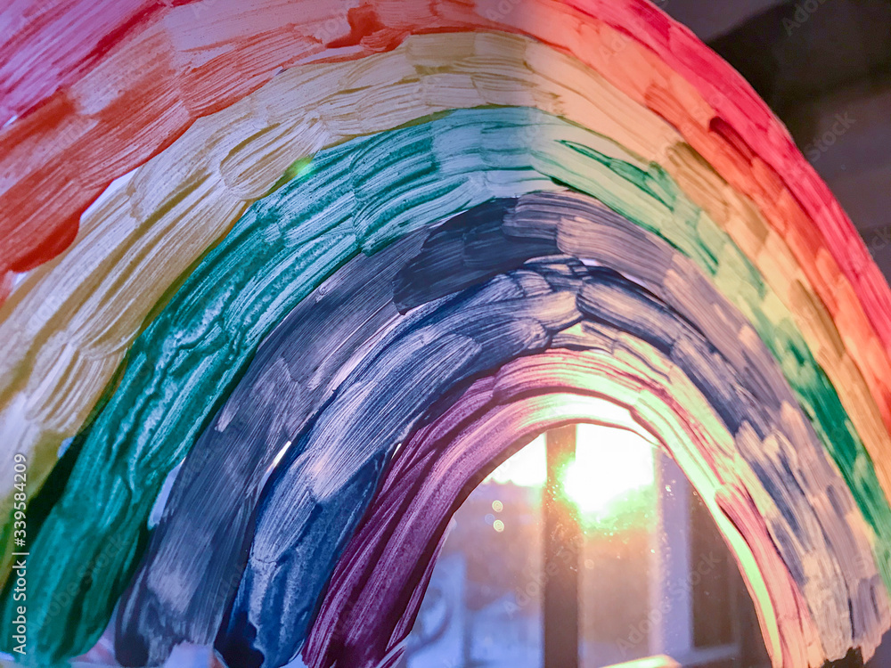 painting rainbow during Covid-19 quarantine at home. Stay at home ...