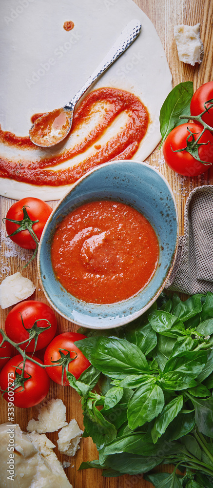 Red pizza sauce, fresh tomatoes, basil, dough and parmesan. Raw ...