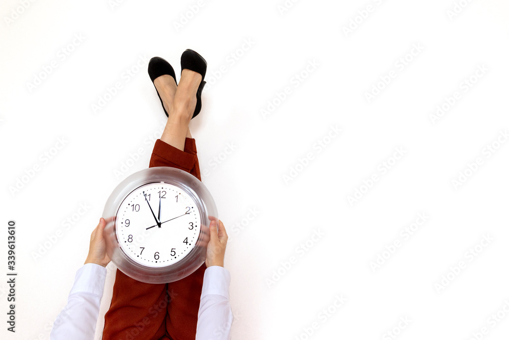 Legs in office suit and high heels up on the wall and holding office ...