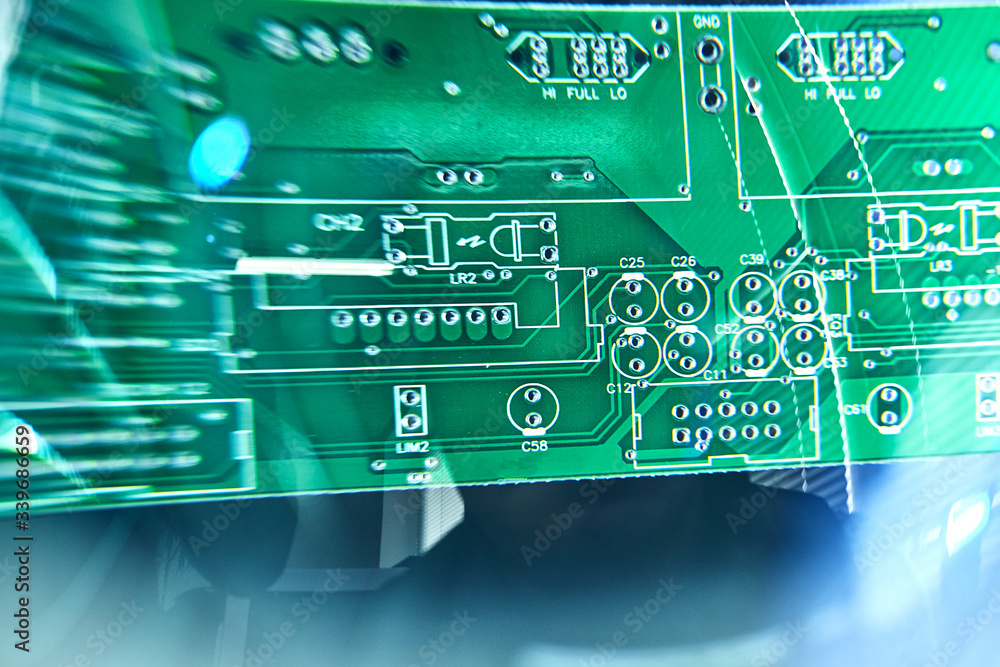 Green system board with microchips and transistors. Engineer factory ...