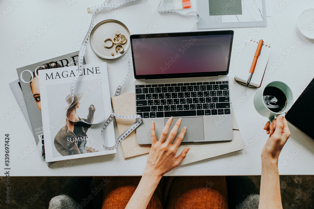 Fashion blogger using a laptop Stock Photo | Adobe Stock