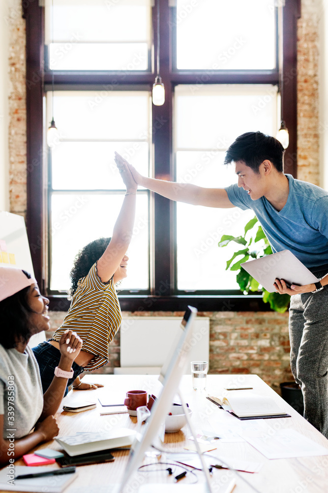 Team high five for success Stock Photo | Adobe Stock