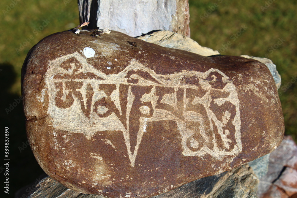 Mantra "Om mani padme hum" on the stone. Buddhism sign. Stock Photo ...
