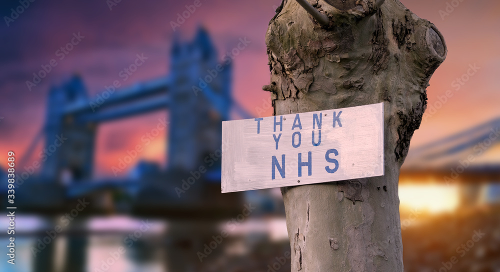 Thank you NHS sign with London sunset city blurred background during ...