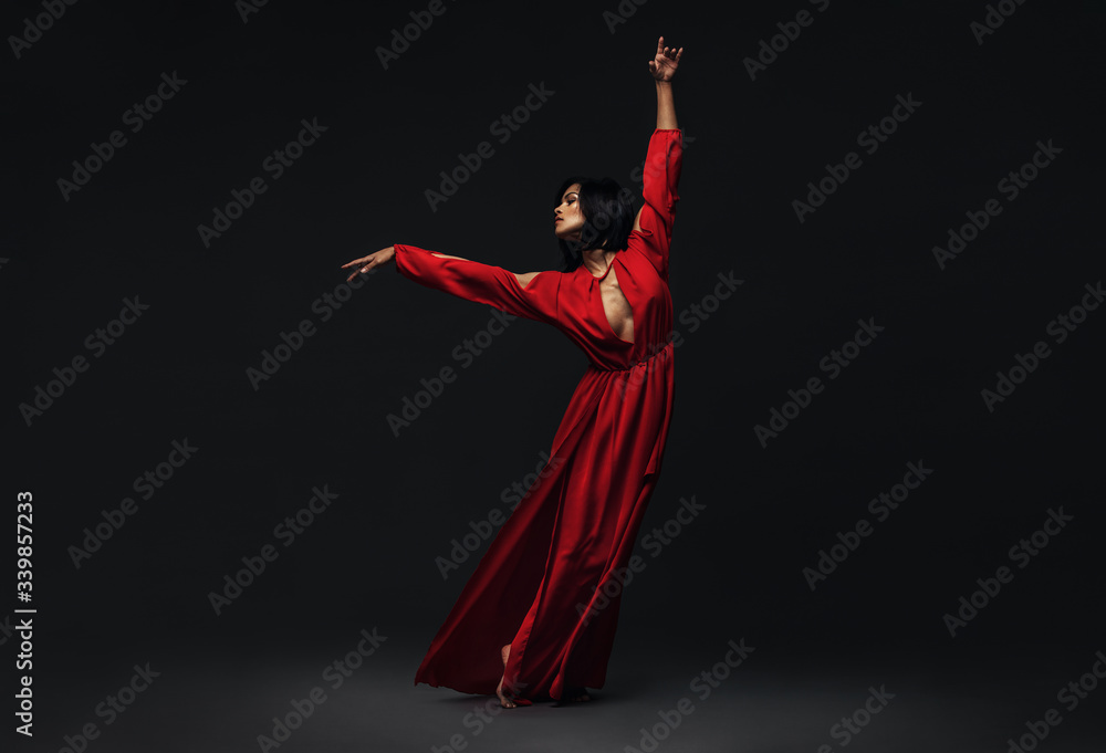 Woman performing beautiful dance moves Stock Photo | Adobe Stock