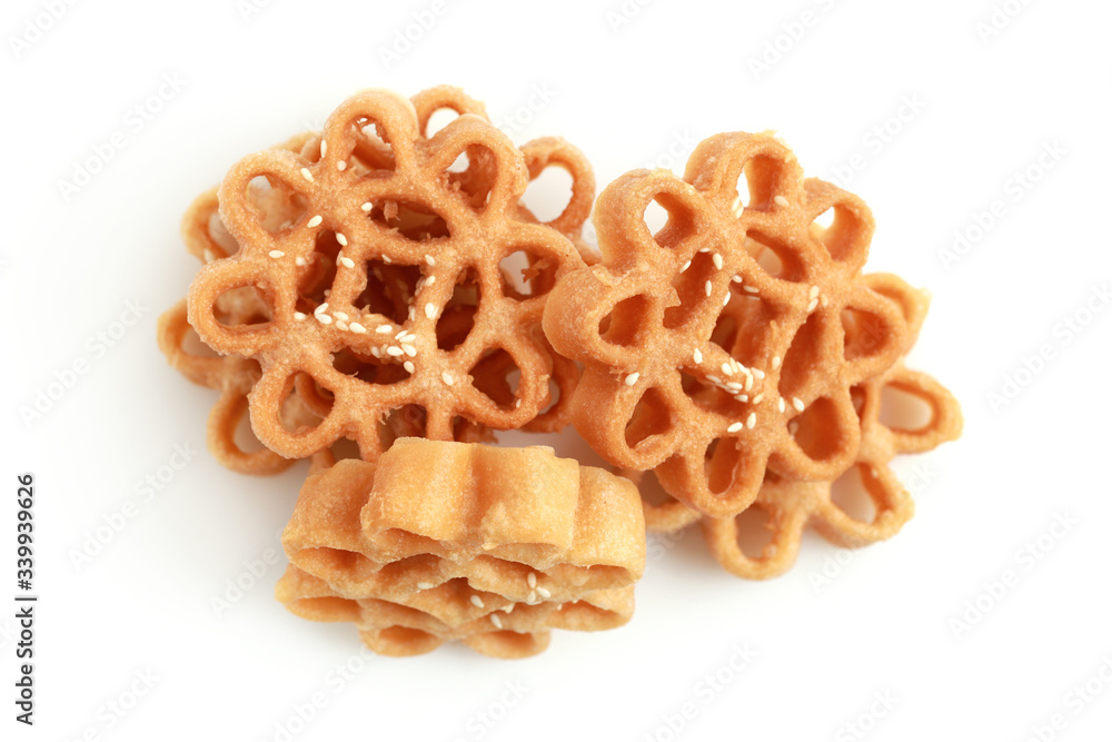 Honeycomb cookies also known as Kuih Loyang on white background. This ...